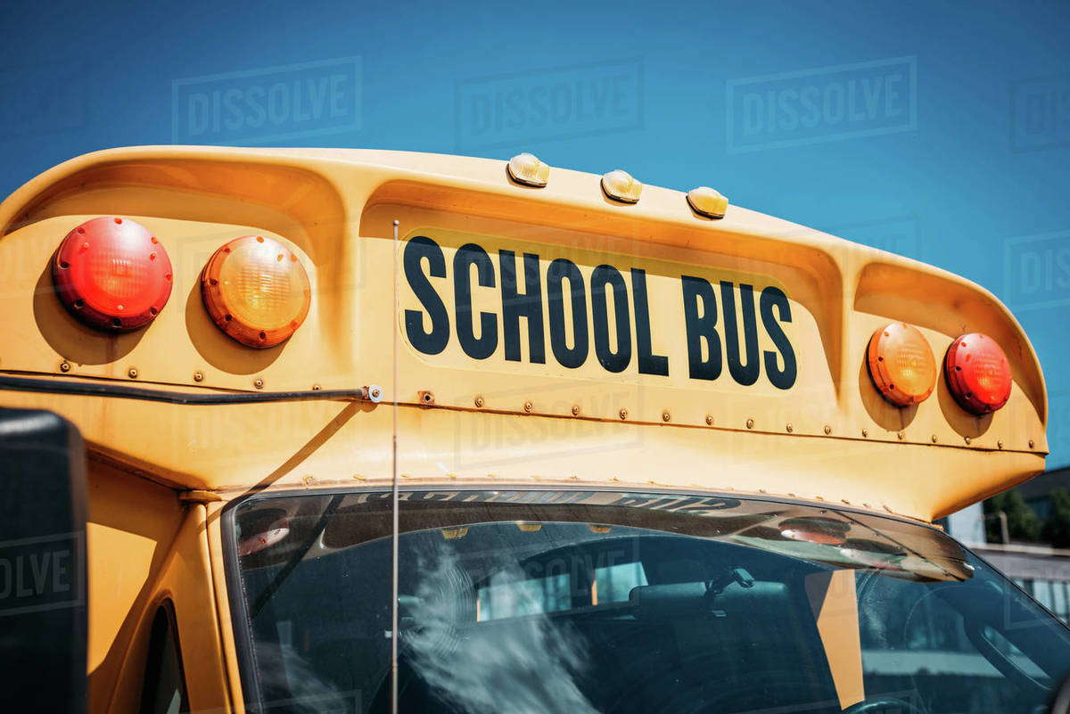 close-up shot of school bus with sign in front of blue sky - Royalty ...
