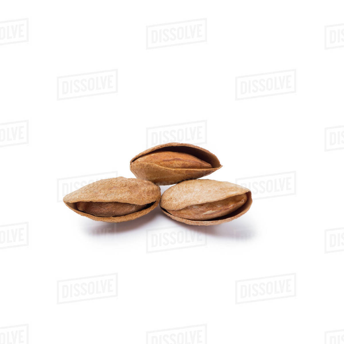 Handful of almonds in nutshells isolated on white background - Royalty ...