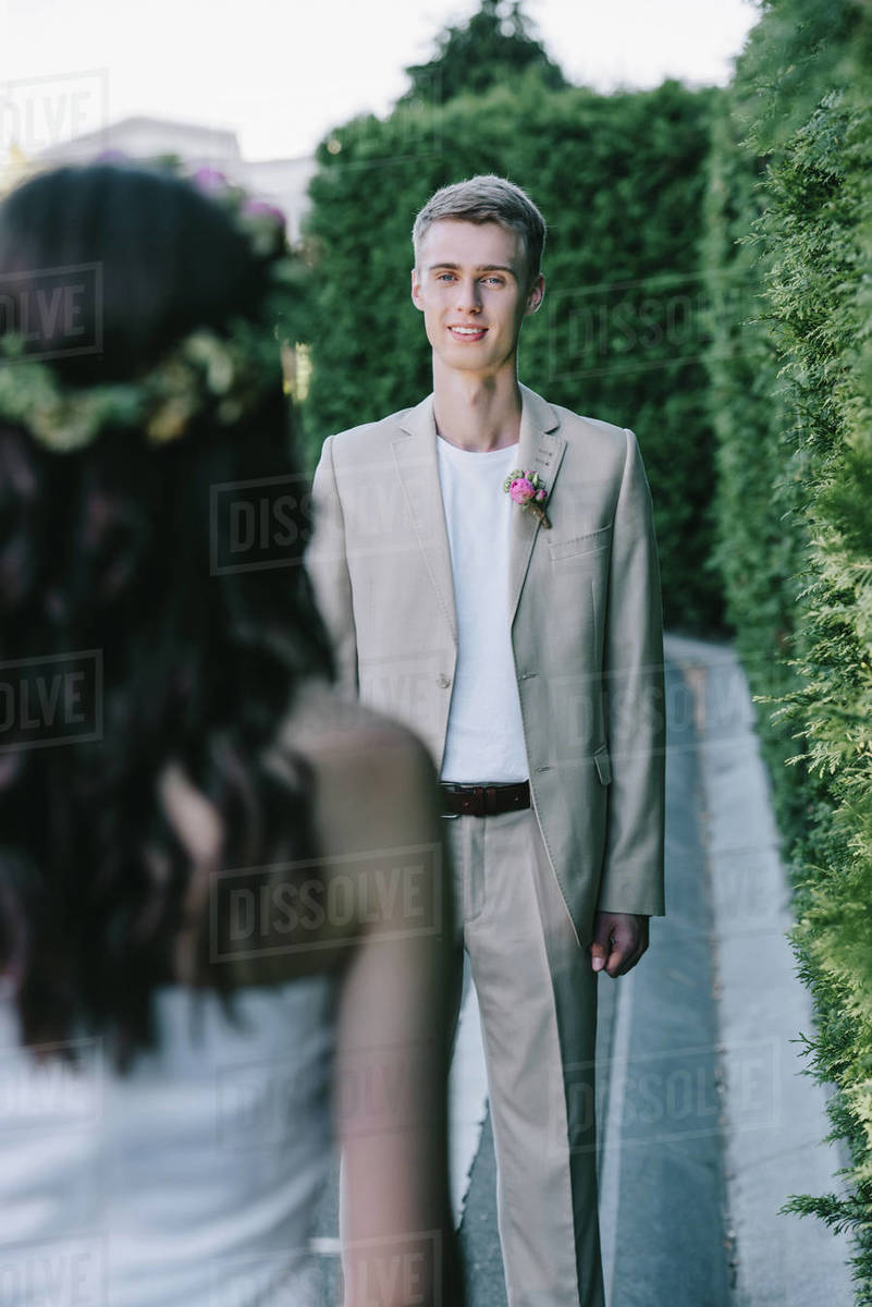 Selective focus of happy handsome groom looking at bride - Royalty-free ...