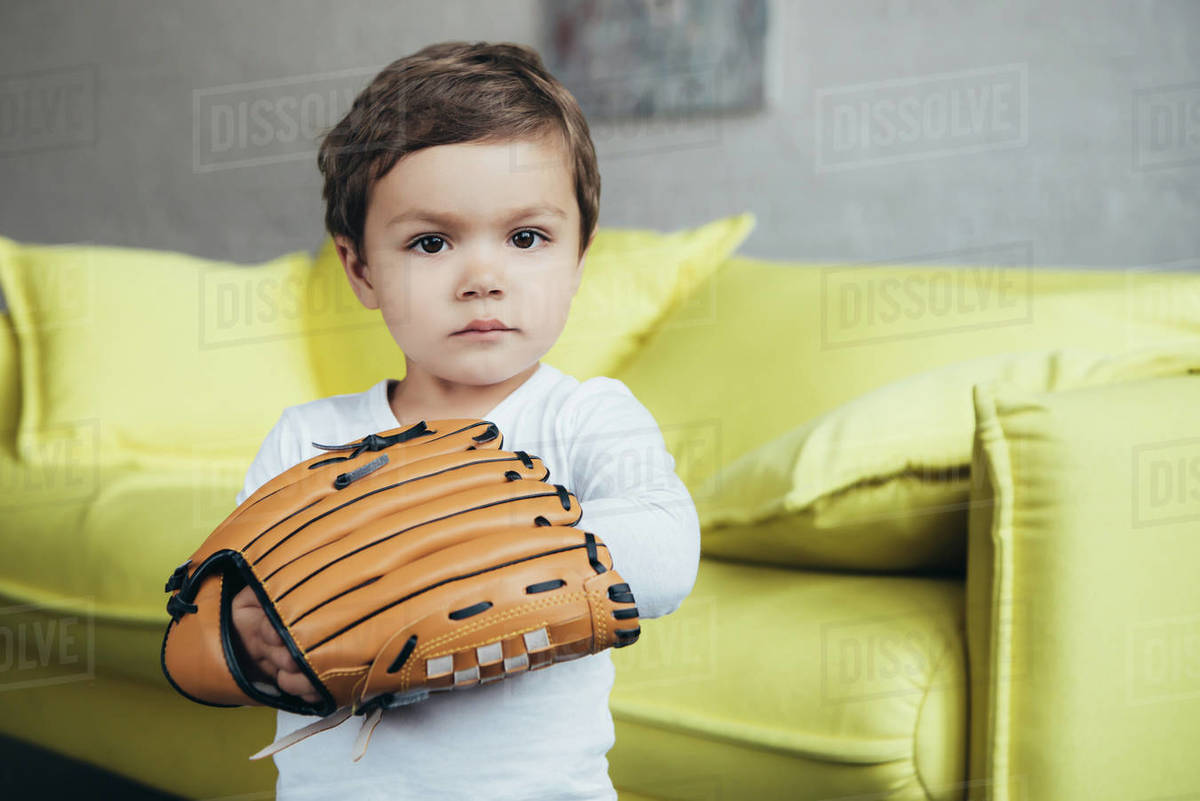 Adorable little boy playing with baseball glove - Royalty-free Stock ...
