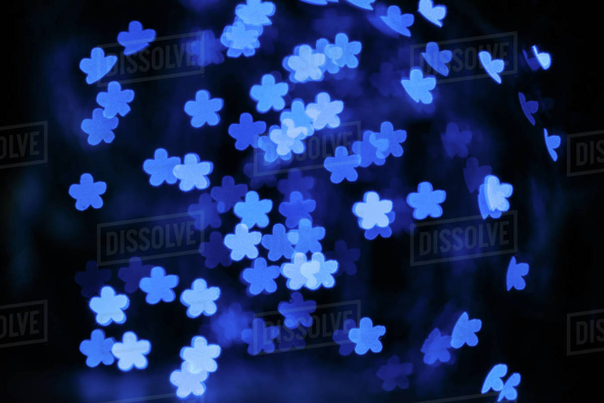 Beautiful blue shiny stars bokeh on black background - Stock Photo ...