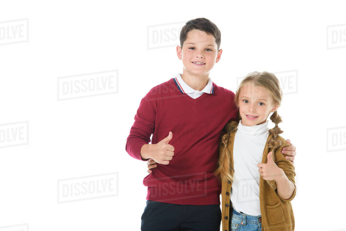 Siblings hugging and showing thumbs up, isolated on white - Royalty ...
