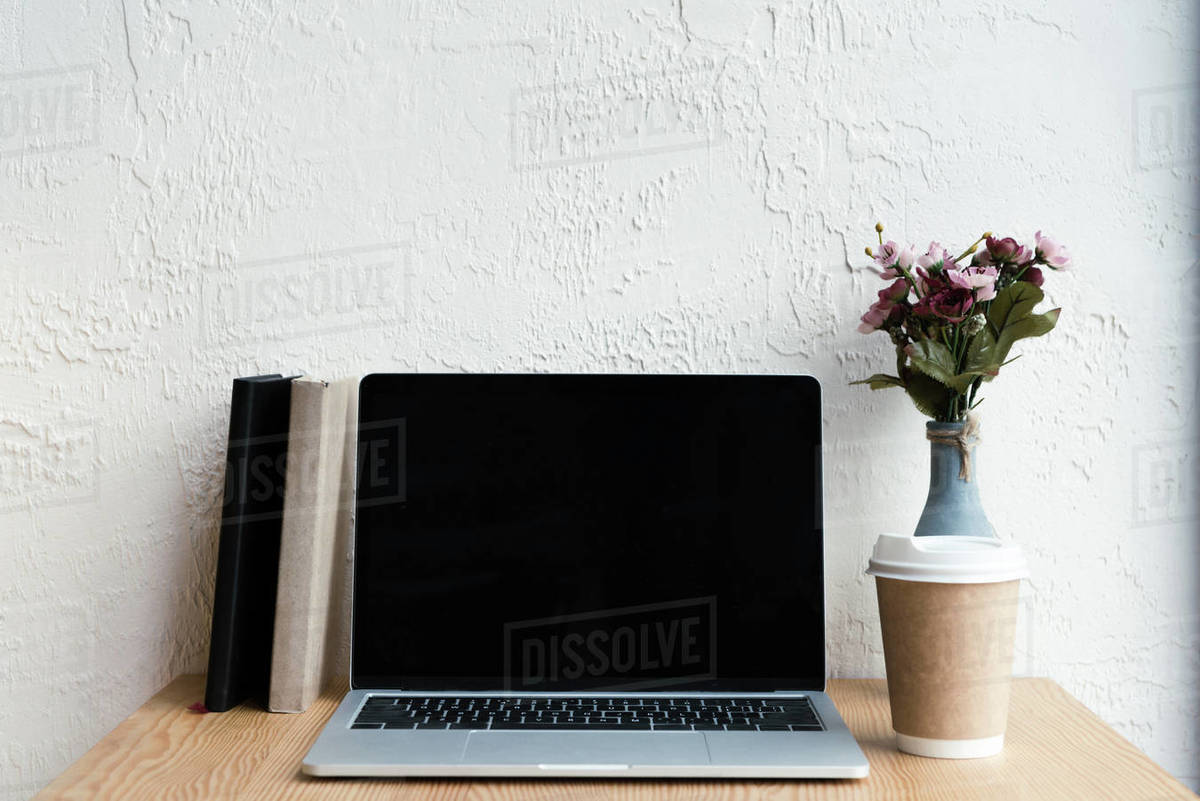 laptop with blank screen and paper cup on wooden table - Stock Photo ...