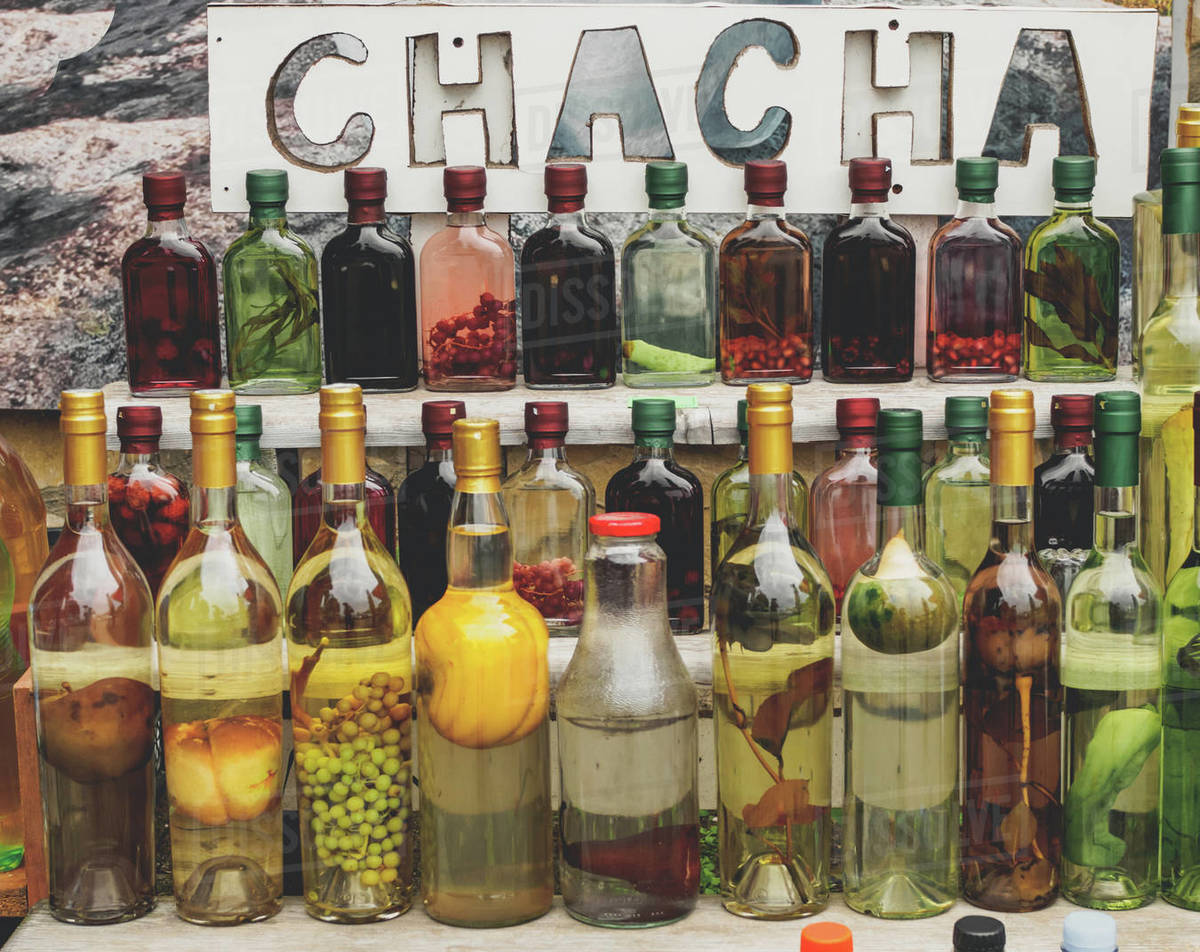 Traditional georgian alcohol drink chacha in bottles with different ...