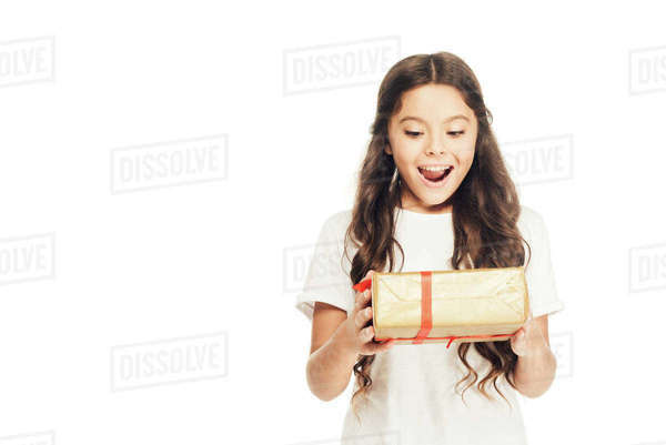 Excited adorable child looking at present isolated on white - Stock ...