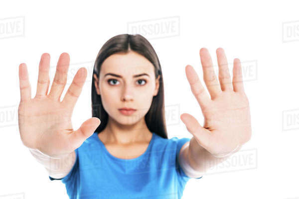 Portrait of serious woman with outstretched hands isolated on white ...