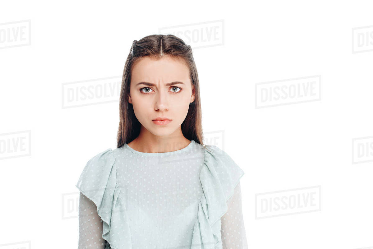 Portrait of upset woman looking at camera isolated on white - Royalty ...