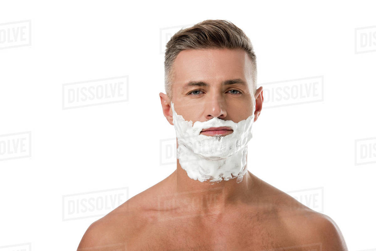 Portrait of adult man with shaving foam on face looking at camera isolated on white - Royalty ...