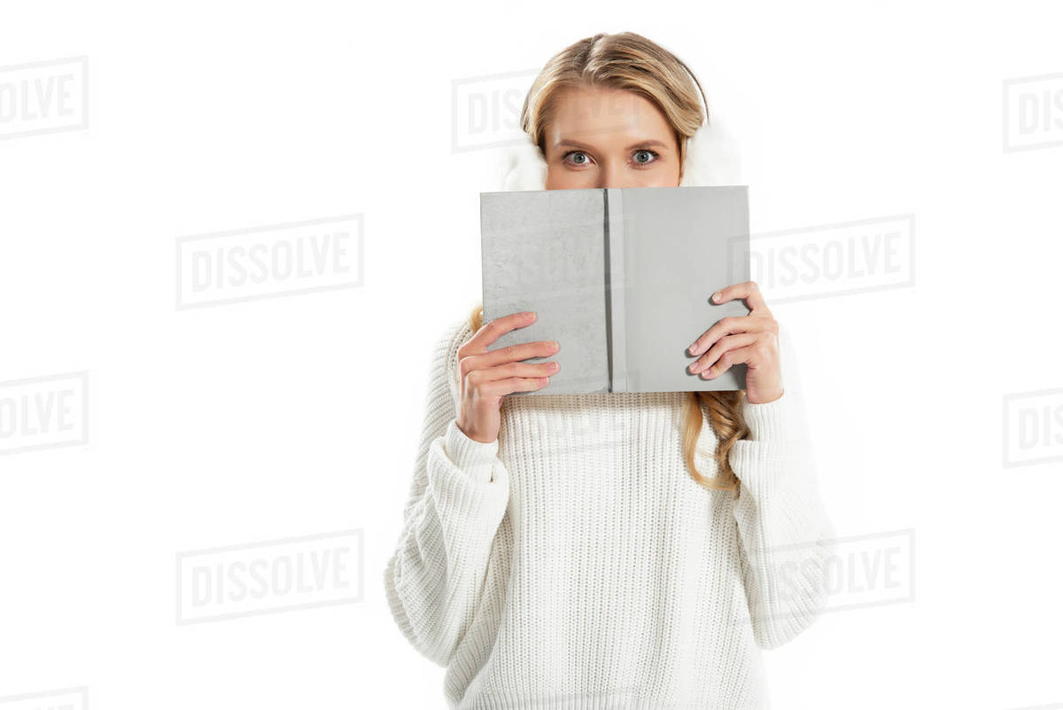 happy girl hiding behind the book isolated on white - Stock Photo ...