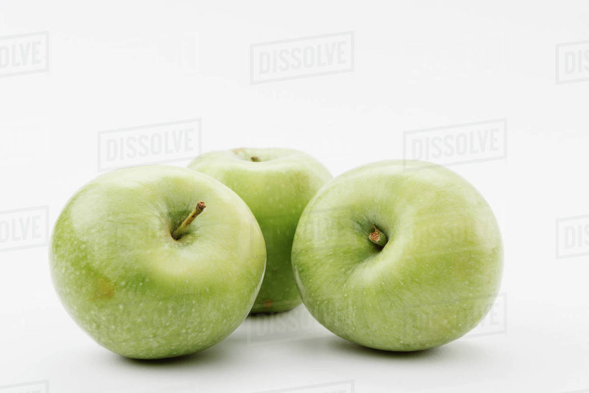 delicious large green apples on white background - Stock Photo - Dissolve