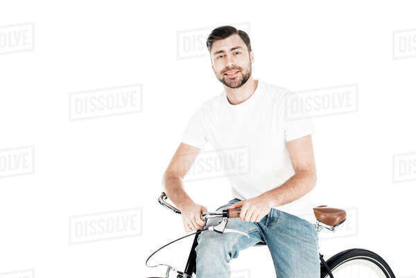 Handsome smiling man riding bicycle isolated on white - Royalty-free ...