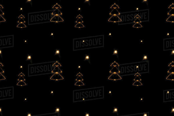 Full frame of fir tree light signs on black backdrop - Royalty-free ...