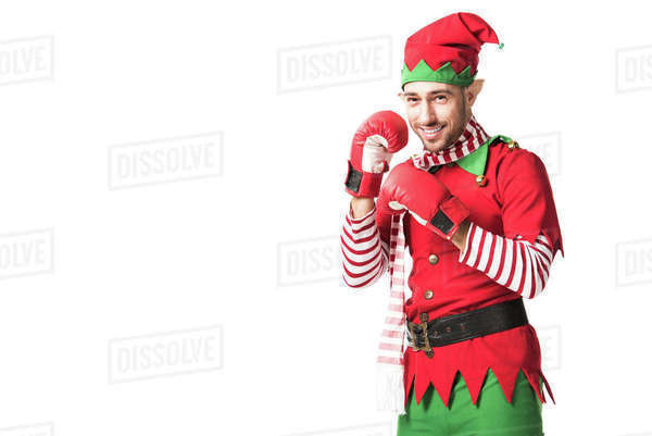 smiling man in christmas elf costume wearing red boxing gloves and ...
