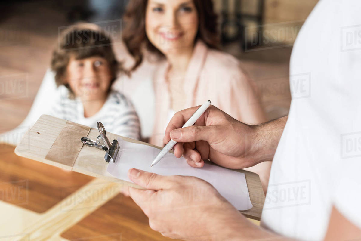 Smiling mother and son making order in cafe - Royalty-free Stock Photo ...