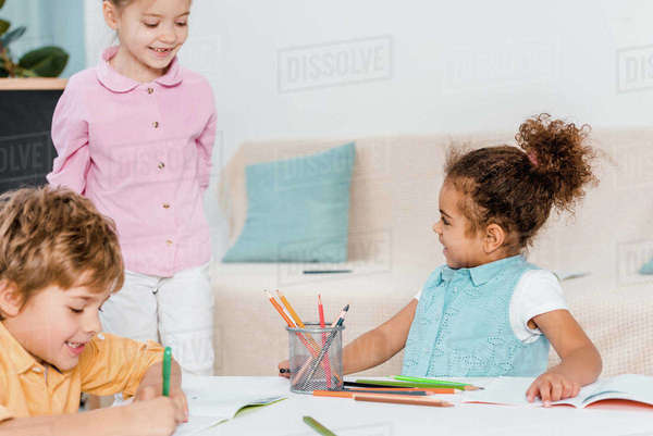 Cute happy multiethnic kids drawing together - Royalty-free Stock Photo ...