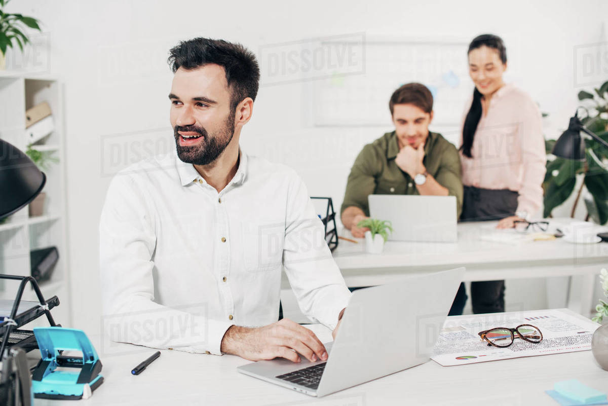 Selective focus of male manager looking surprised in modern office ...