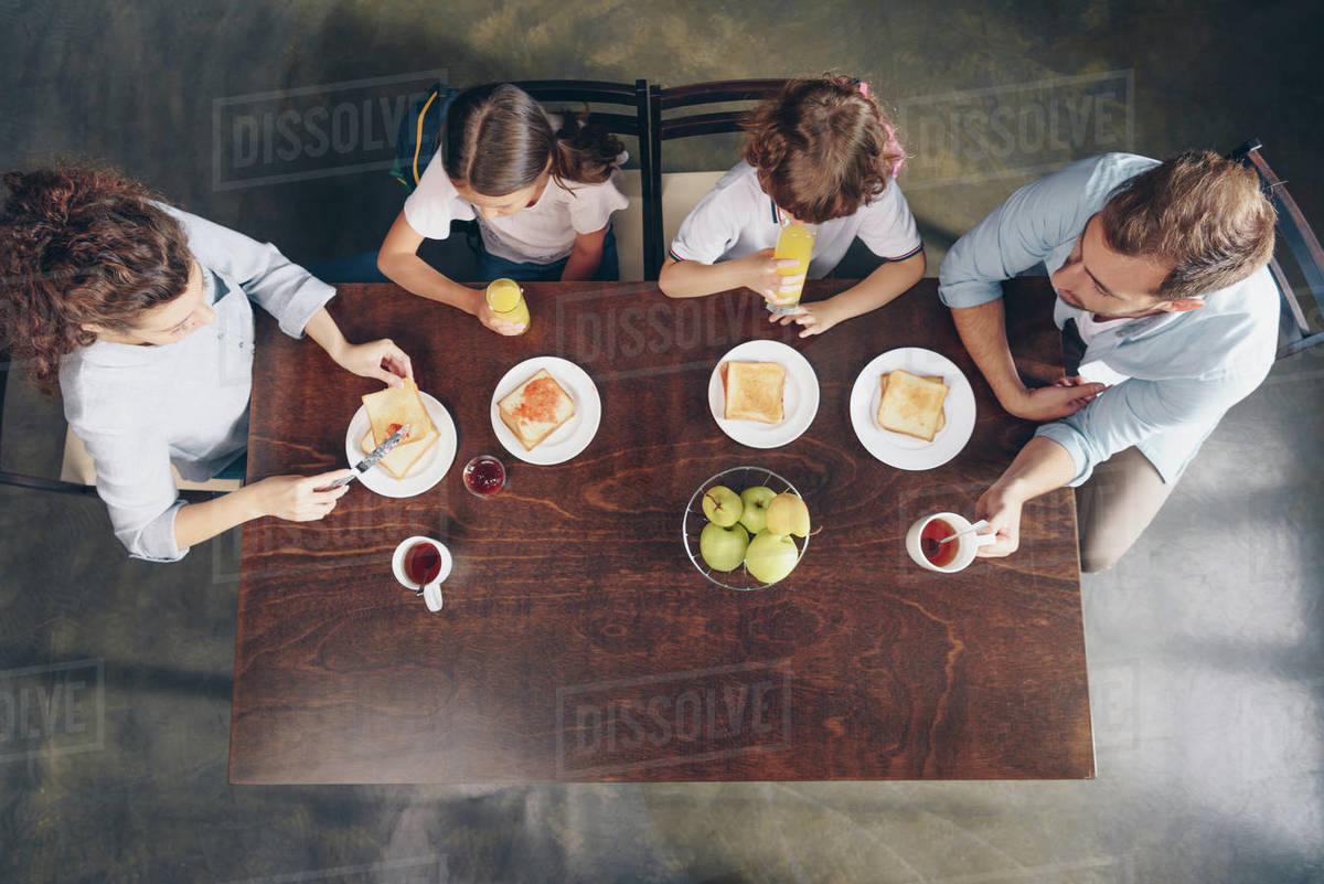 Top view of young happy family having breakfast - Royalty-free Stock ...