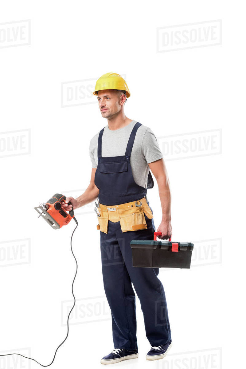 Construction worker holding tool box and electric fret saw isolated on ...