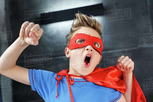 Little boy in red superhero costume gesturing and screaming - Royalty ...