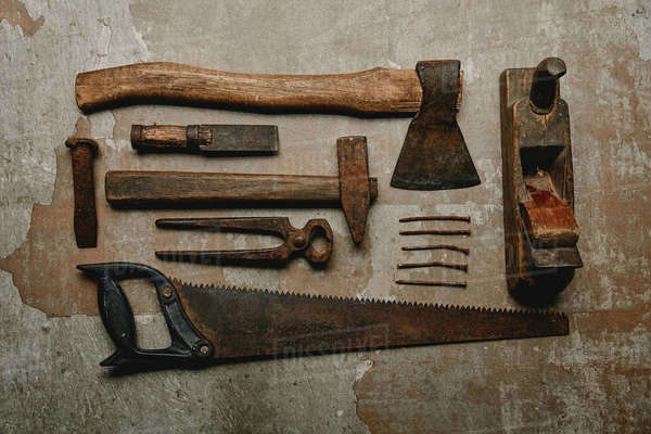 Top view of various rusty carpentry tools on old background - Stock ...
