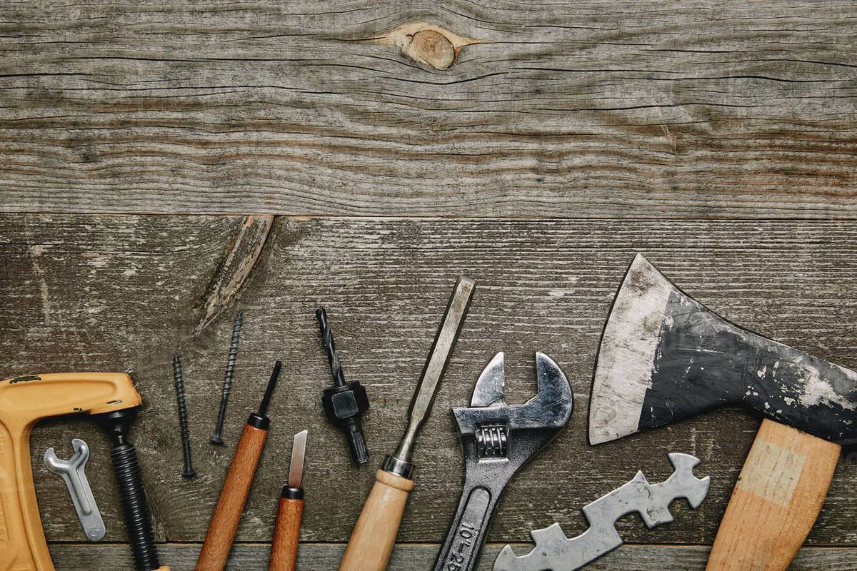 Top view of various carpentry tools on wooden background - Royalty-free ...