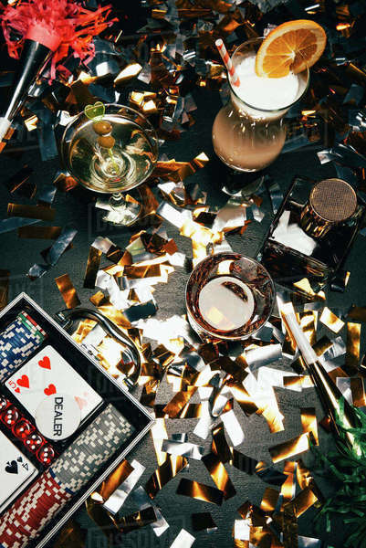 Top view of alcoholic cocktails, playing cards, poker chips and party ...