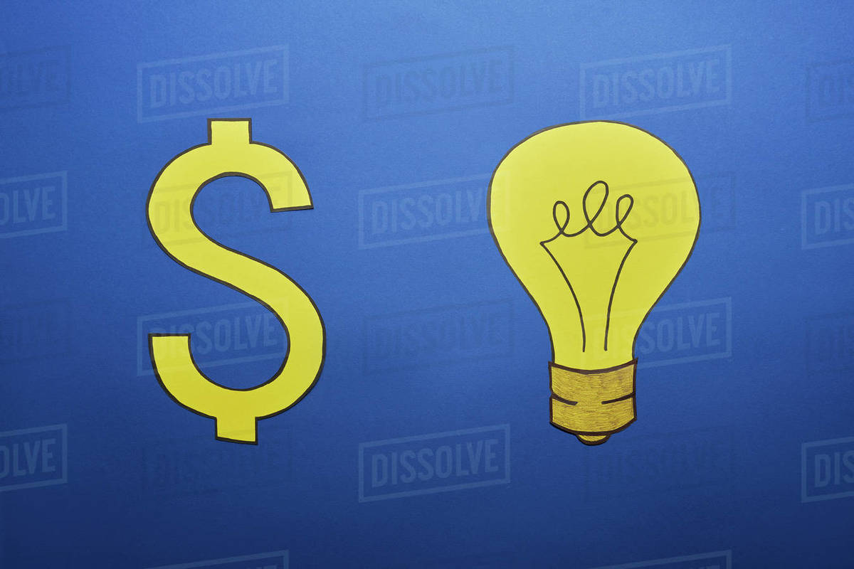 Top view of yellow paper light bulb and dollar sign on blue background ...