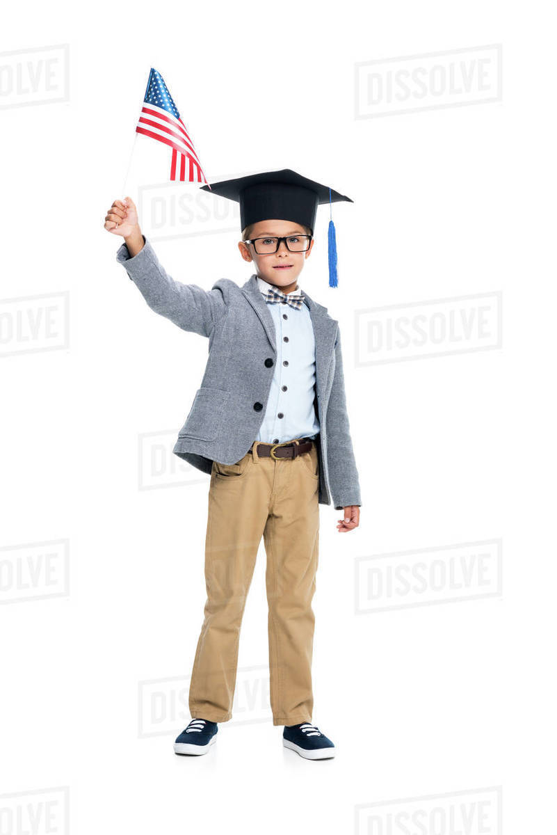 Schoolboy with USA flag and graduation hat isolated on white - Royalty ...