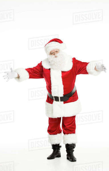 Full length view of Santa Claus posing with outstretched hands and ...
