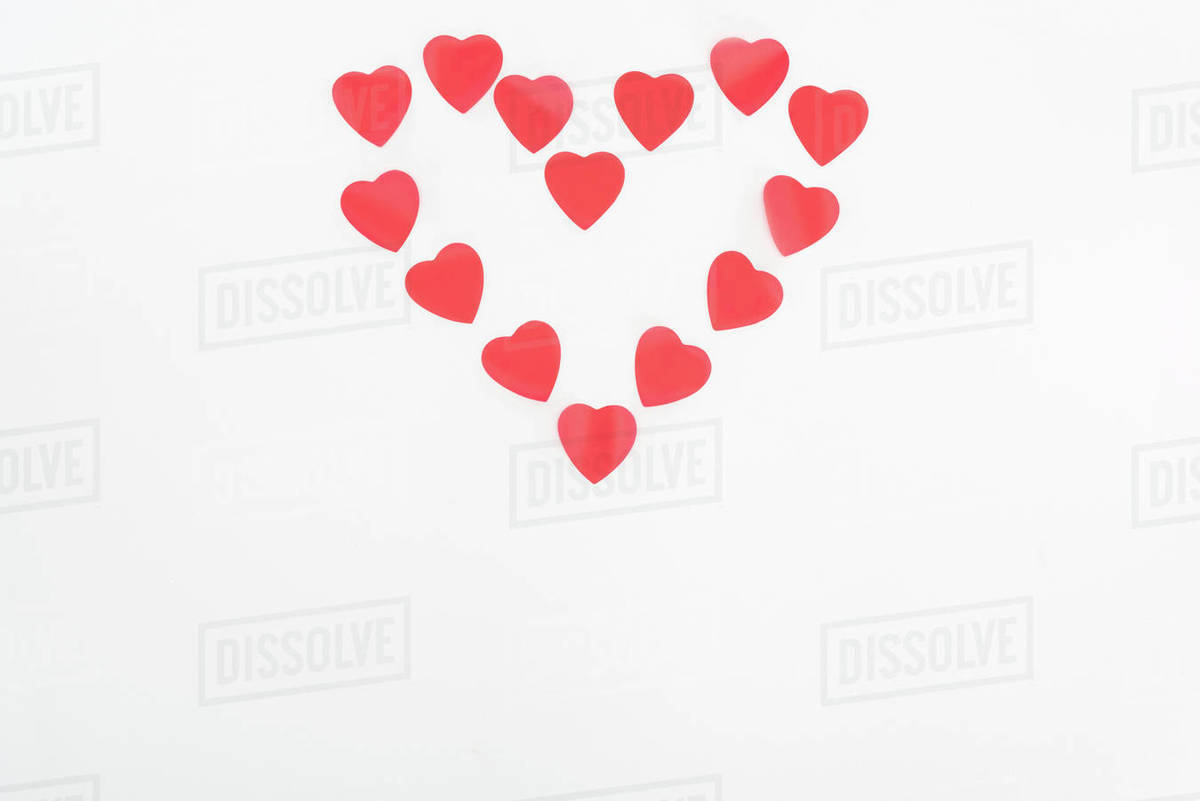 Flat lay with heart made of red heart symbols isolated on white, street ...