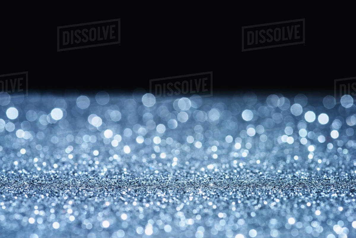Selective focus of blurred sparkling surface on black - Royalty-free ...