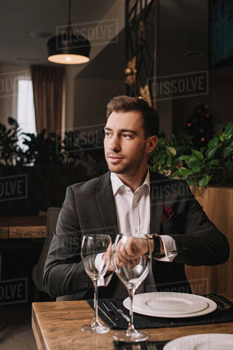 Handsome man waiting for girlfriend in restaurant - Royalty-free Stock ...