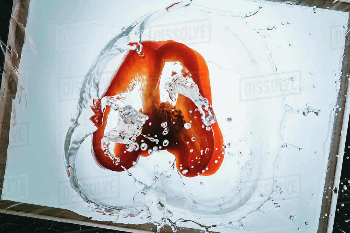 Fresh bell pepper slice floating in water with splash - Royalty-free ...