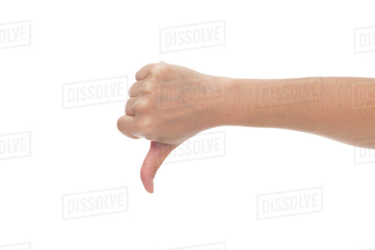 Cropped shot of hand showing thumb down isolated on white - Royalty ...