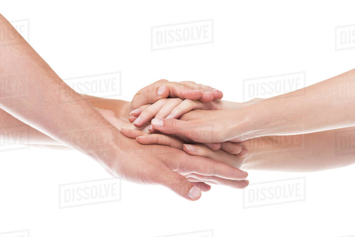 Cropped shot of people stacking hands isolated on white - Royalty-free ...