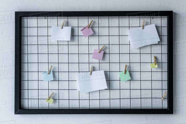 various empty colorful notes hanging on board - Stock Photo - Dissolve