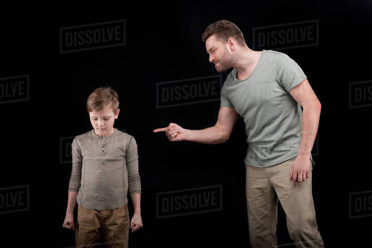Angry father threatening and gesturing to scared little son, family ...