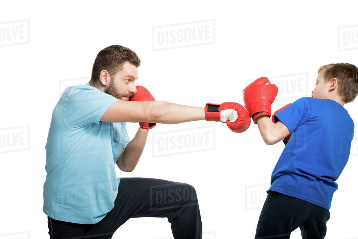 Happy father with son during boxing training isolated on white ...
