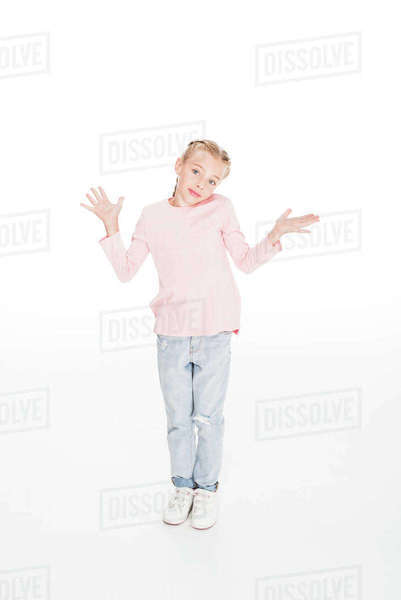 Young child shrugging shoulders, isolated on white - Stock Photo - Dissolve