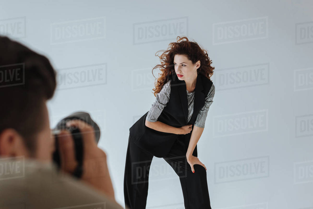 professional photographer and attractive model on fashion shoot in ...