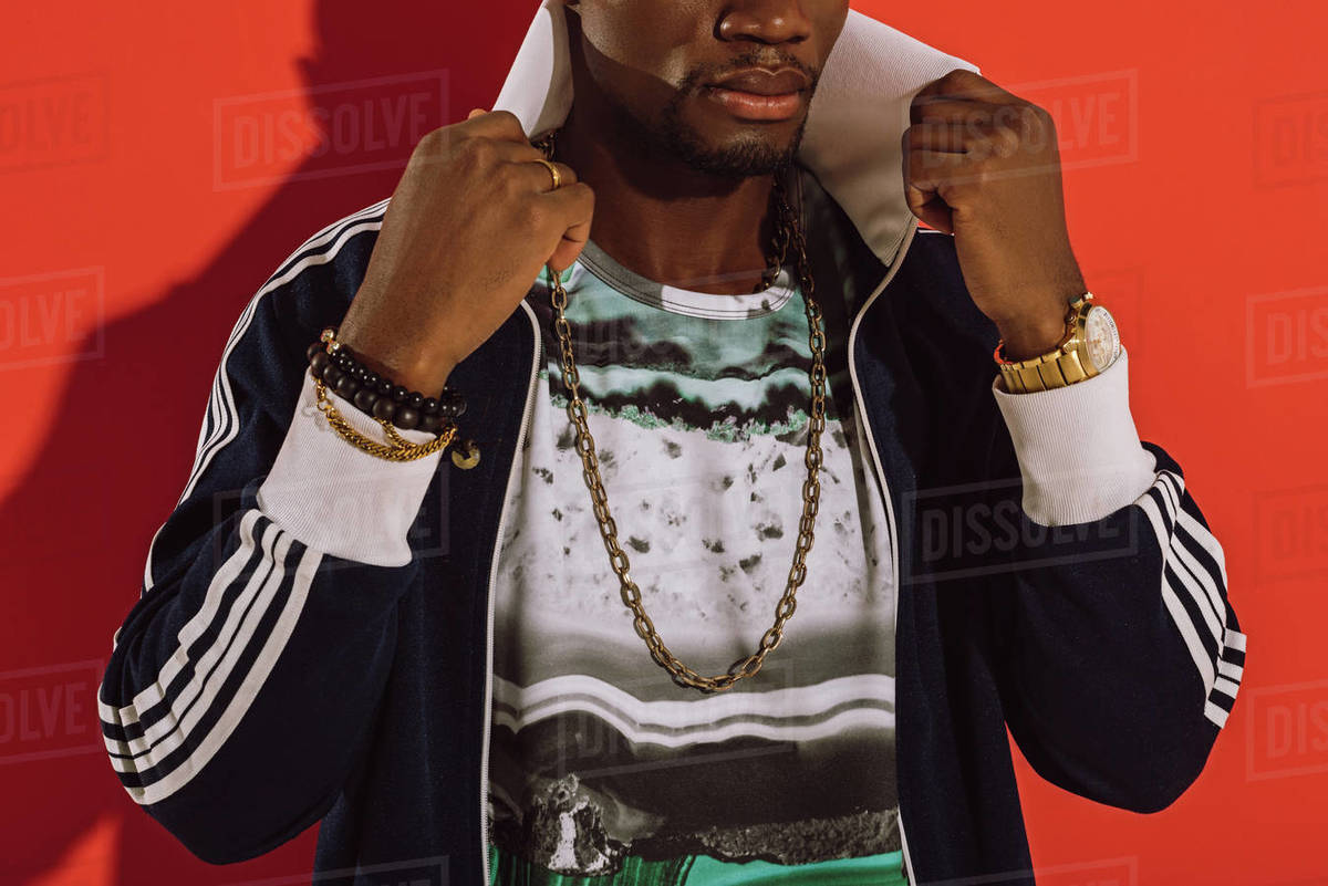 Cropped shot of stylish African American man adjusting jacket - Royalty ...