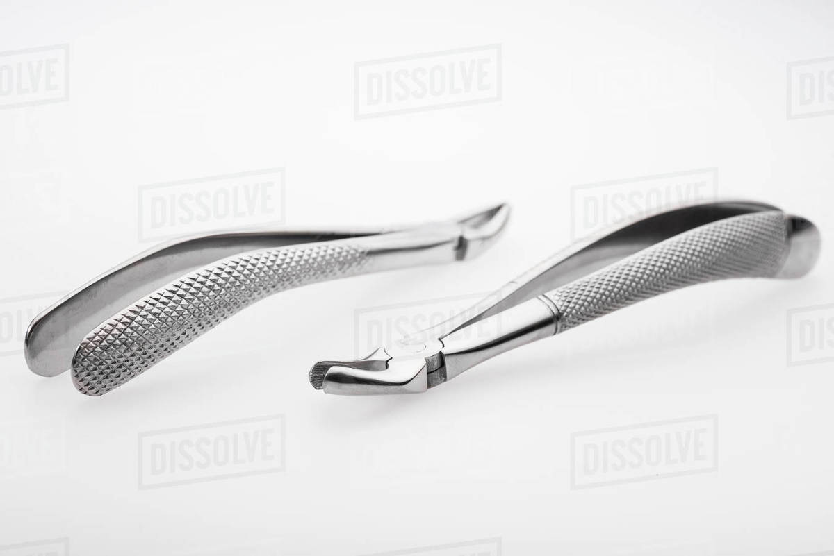 Close-up view of professional orthodontic instruments isolated on white ...