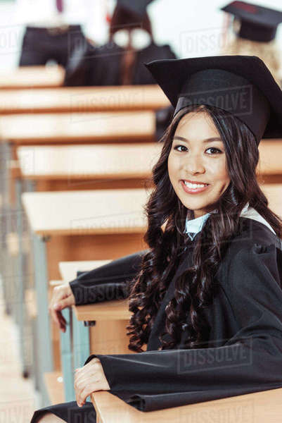 graduated asian student girl sitting at class - Stock Photo - Dissolve