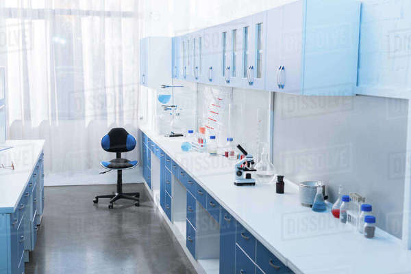 Interior of a professional chemical lab with equipment on counter ...