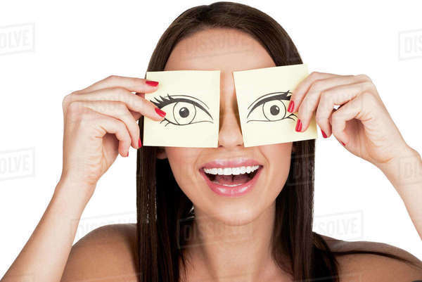 Woman covering eyes with cartoons style drawn eyes on stickers isolated ...