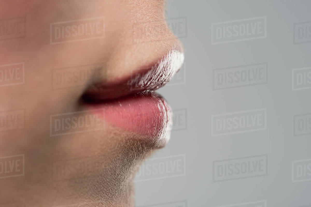 Cropped shot of woman with beautiful pink lips isolated on grey - Stock ...
