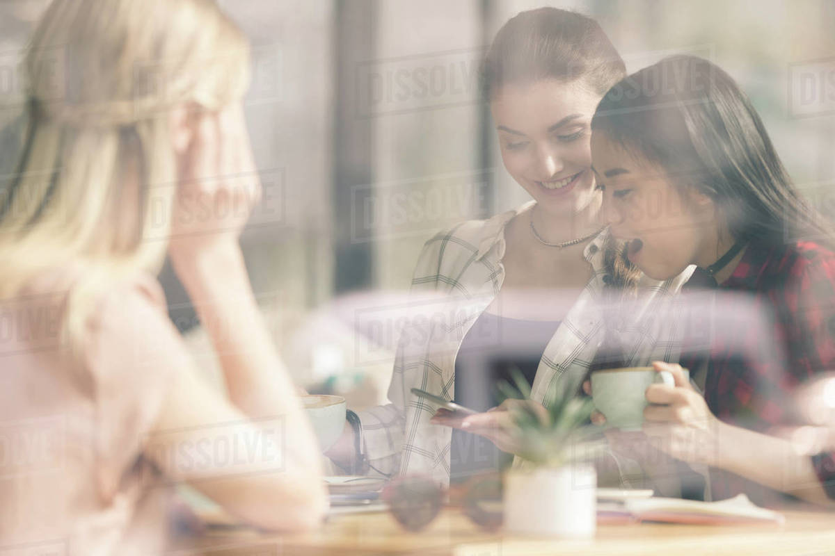 Friends spend time together on coffee break in cafe - Royalty-free ...