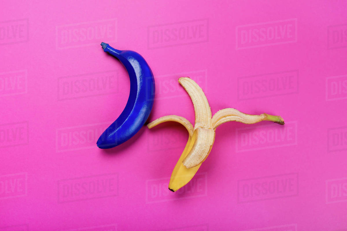 Top view of blue and yellow bananas isolated on pink, ripe bananas ...