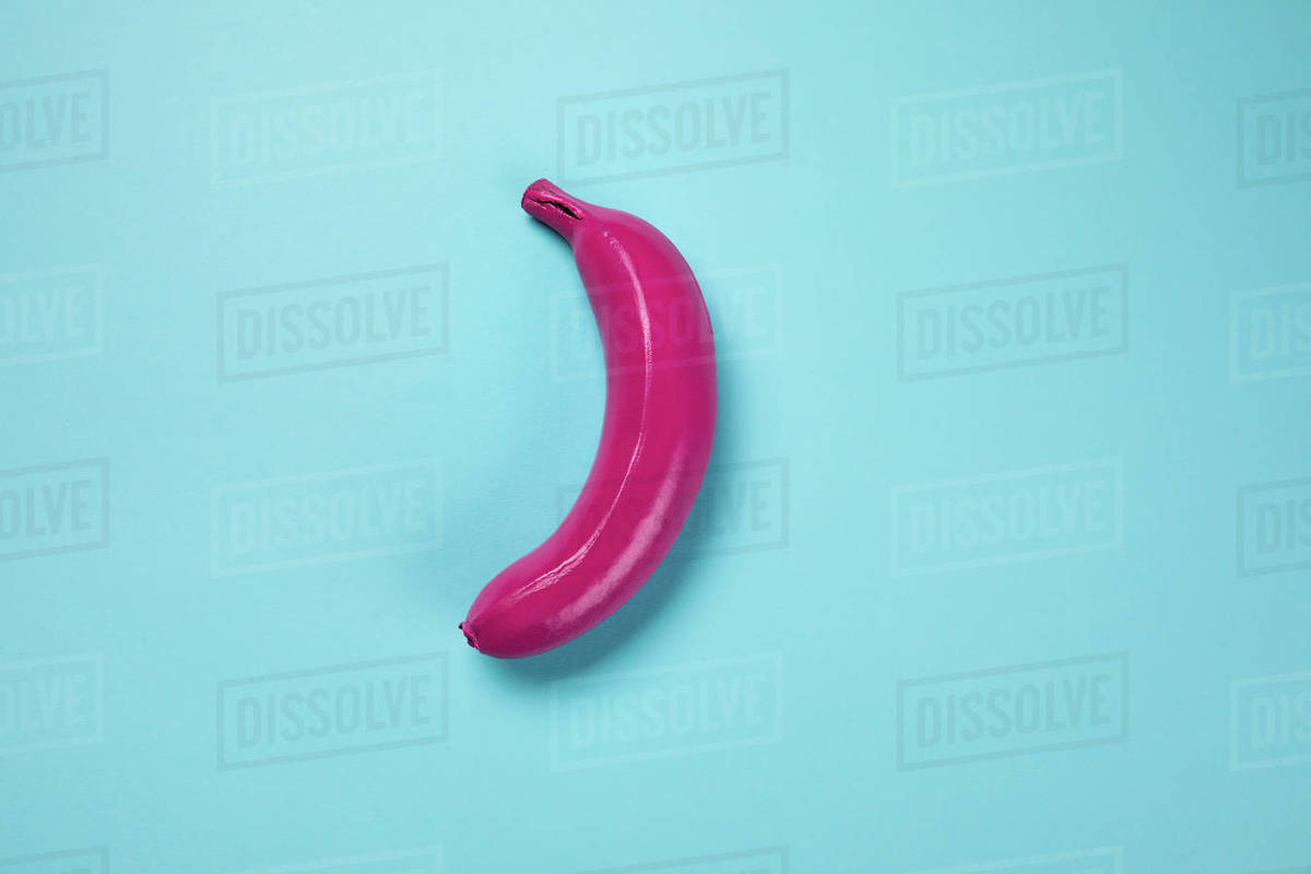 Top view of one whole pink colored banana isolated on blue - Royalty ...