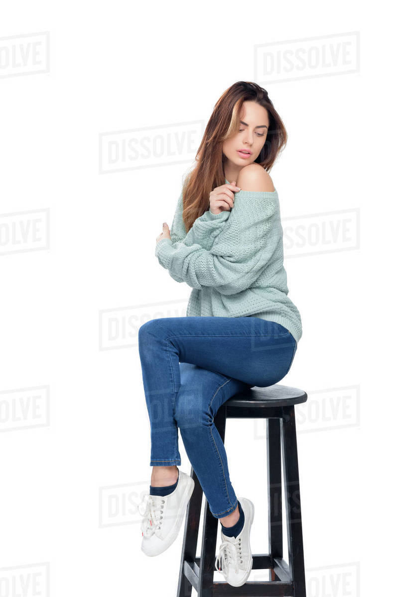beautiful sensual woman posing on stool, isolated on white - Royalty ...
